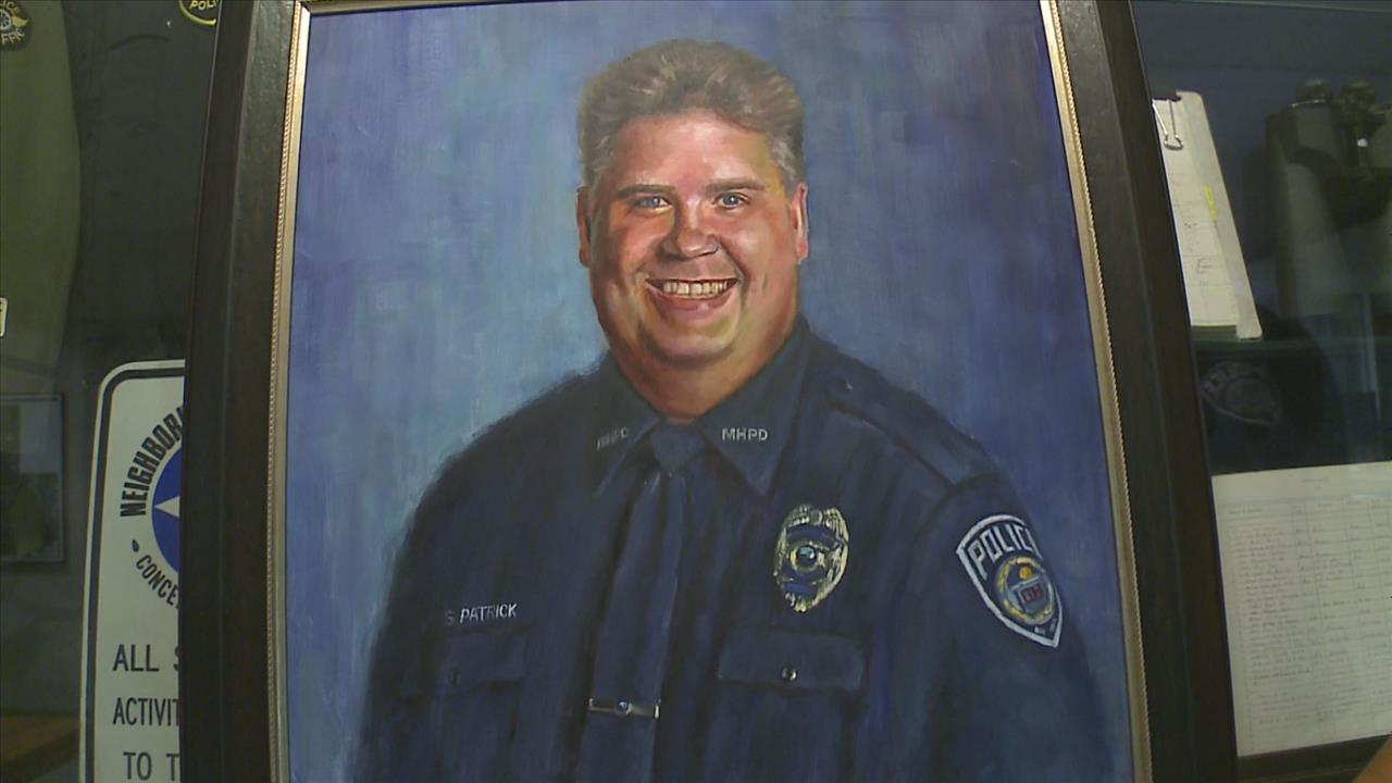 Officer Scott Patrick captured in a portrait of service | kare11.com