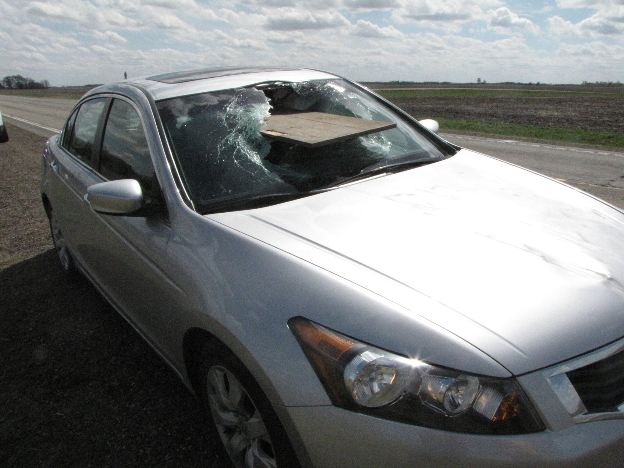 Plywood flies off trailer, shoots through windshield | kare11.com